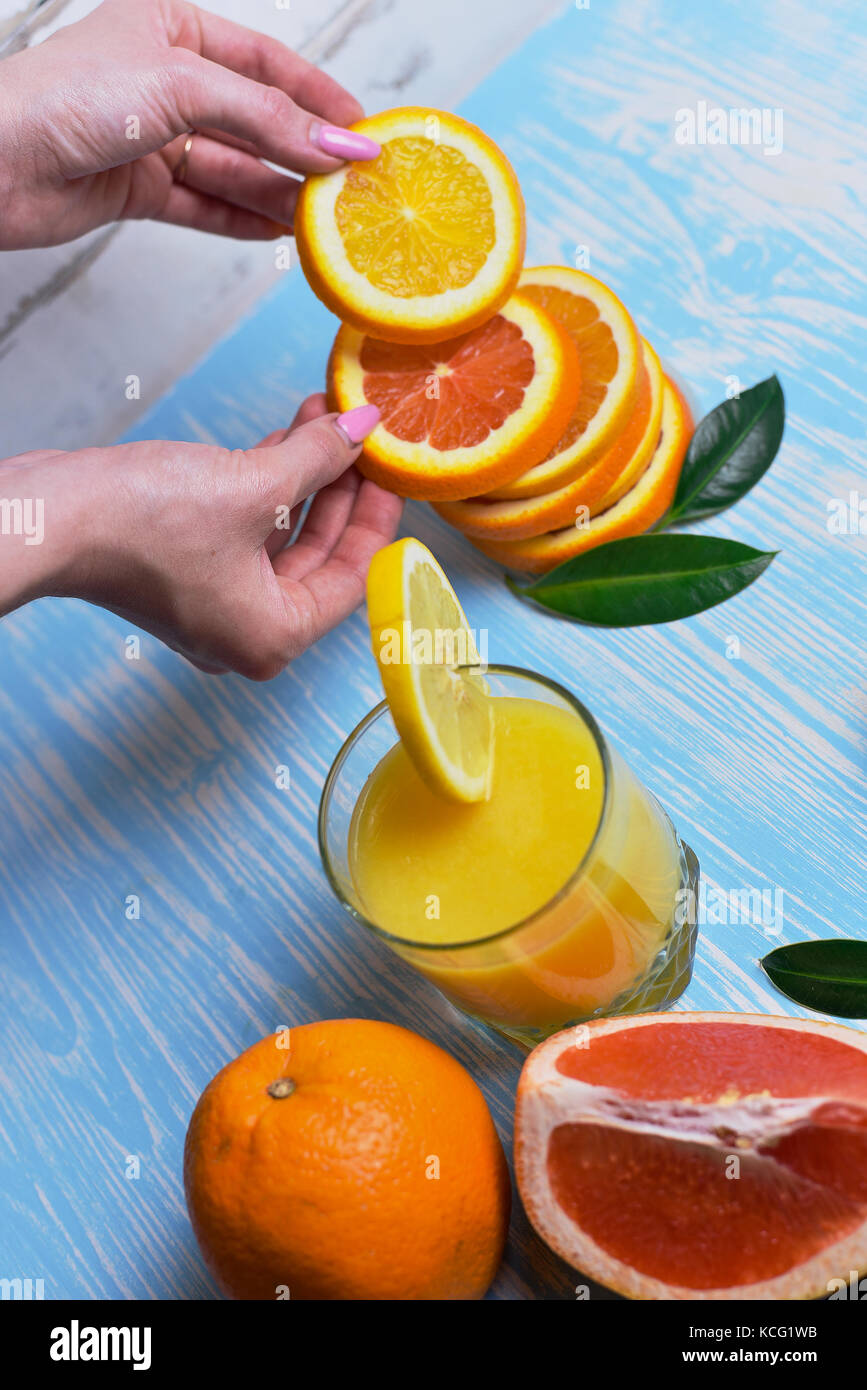 The orange in the hands Stock Photo - Alamy