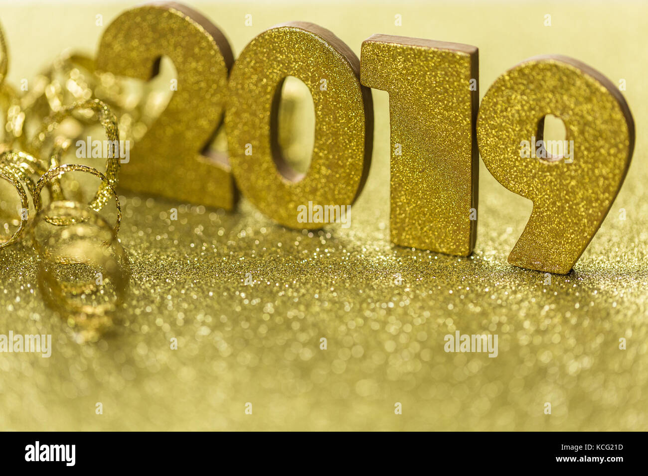 Gold numbers of 2019 year on a gold background Stock Photo - Alamy