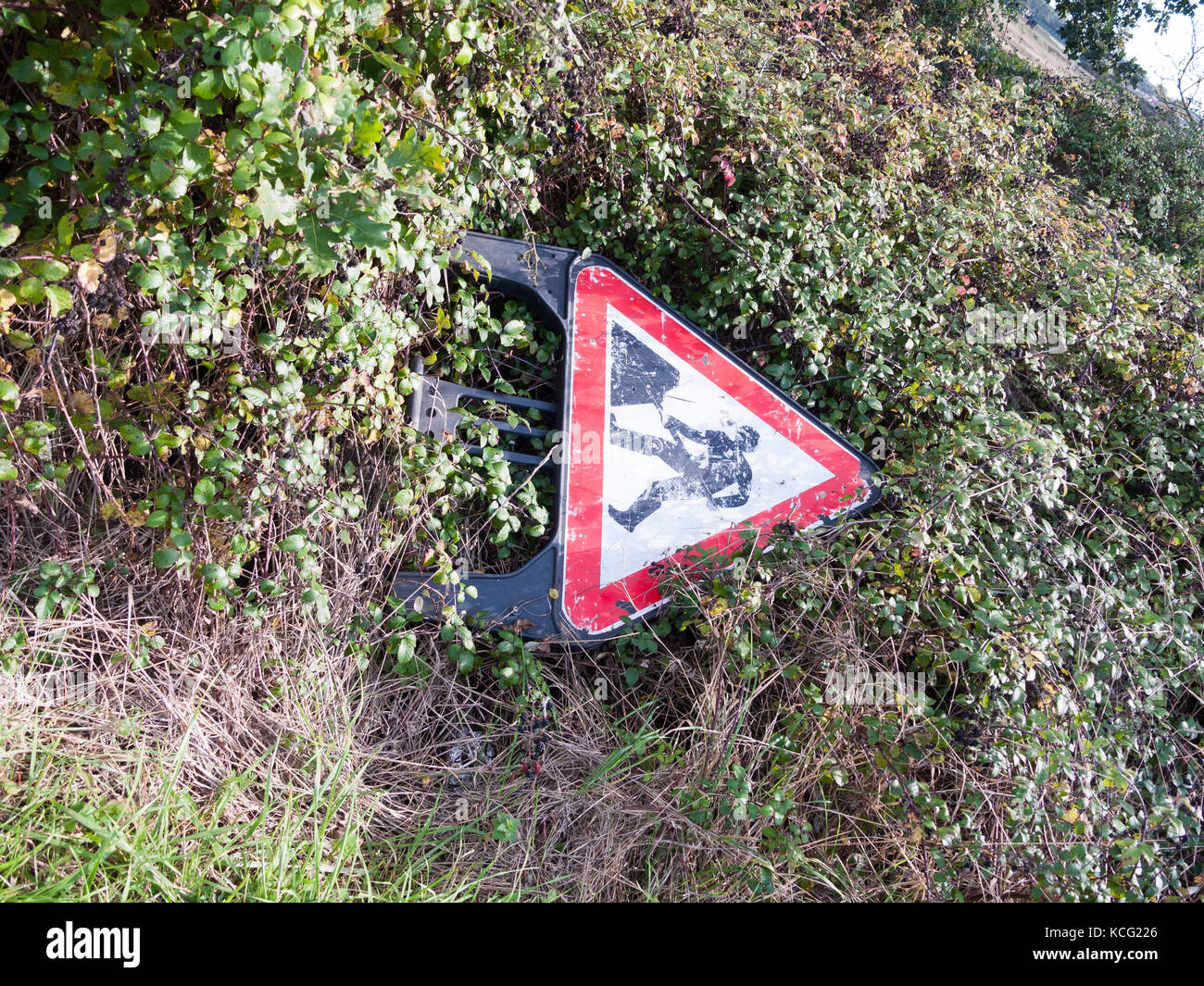 discarded old ruined weathered triangle road sign digging warning ...