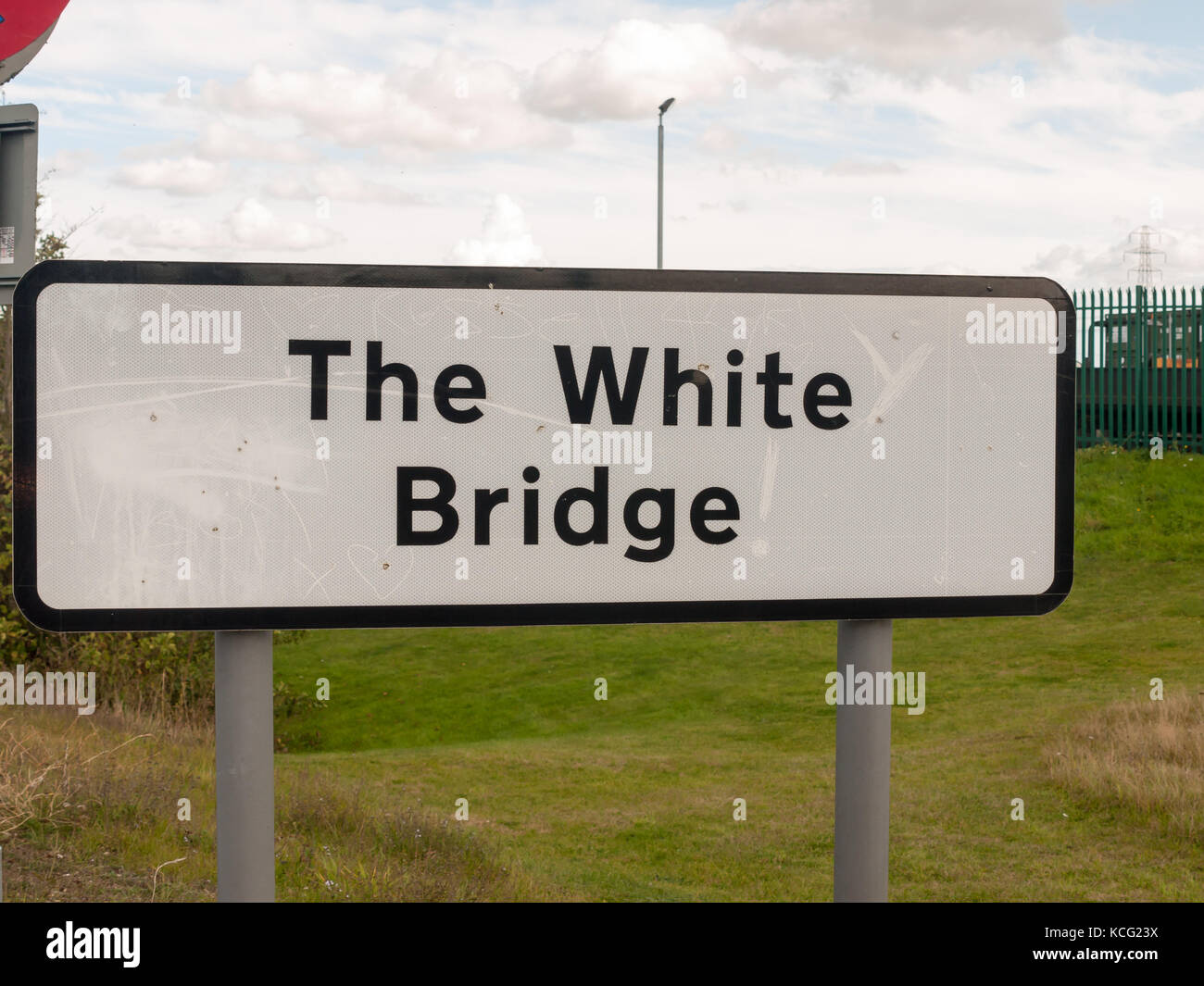 big rectangular black and white road sign the white bridge location ...