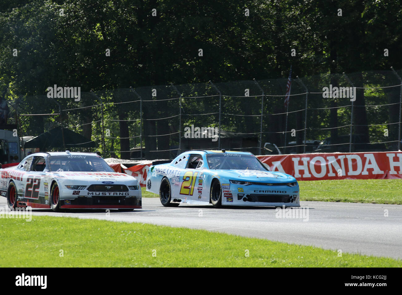 Sam Hornish Jr, Car 22 (soft focus). Daniel Hemric, Car 21 (sharp ...