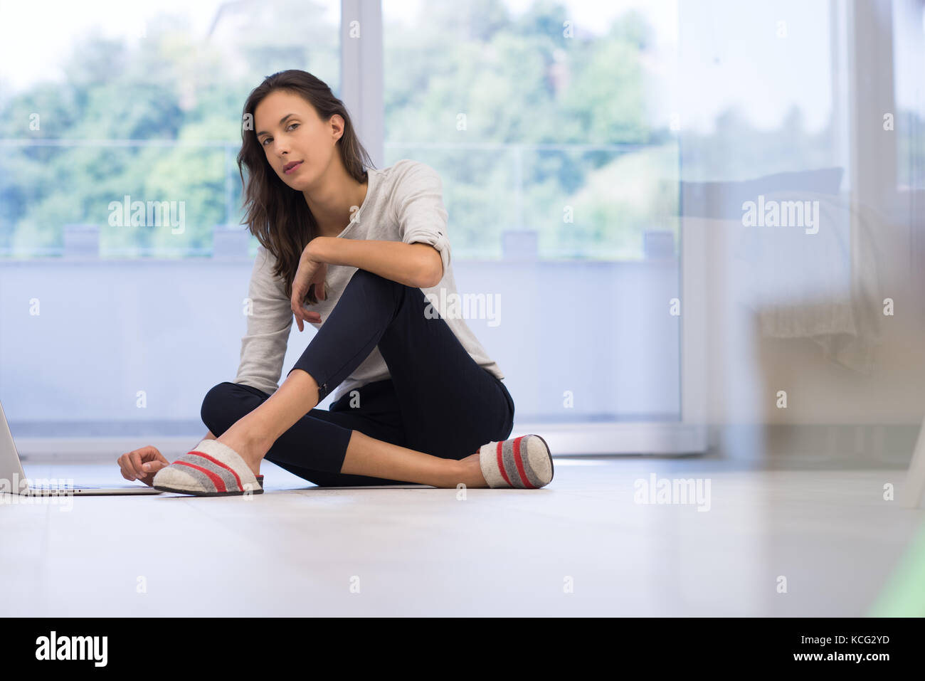 beautiful young women using laptop computer on the floor at home Stock ...
