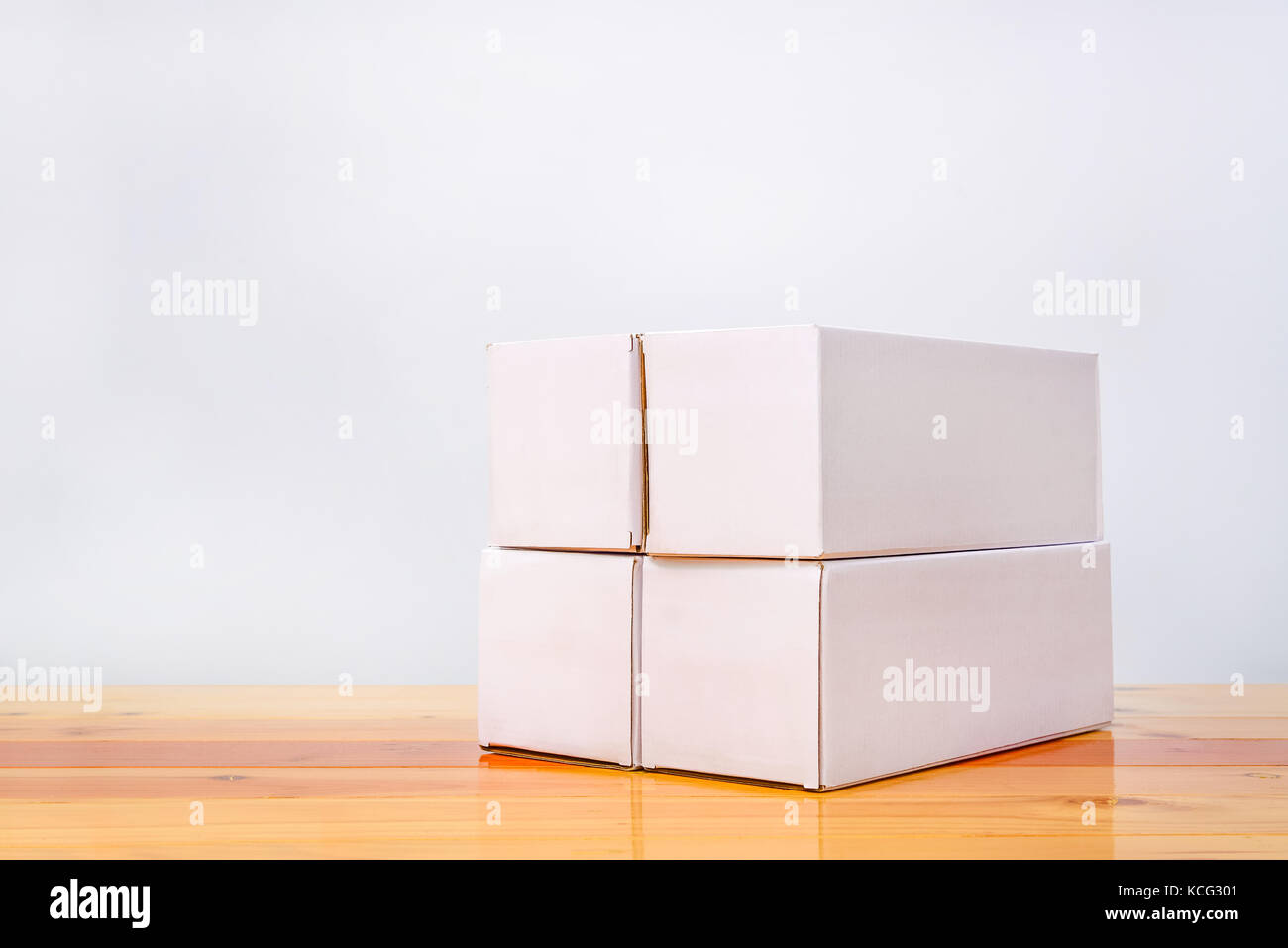 Empty four Package white cardboard box mock up for long items on bright ...