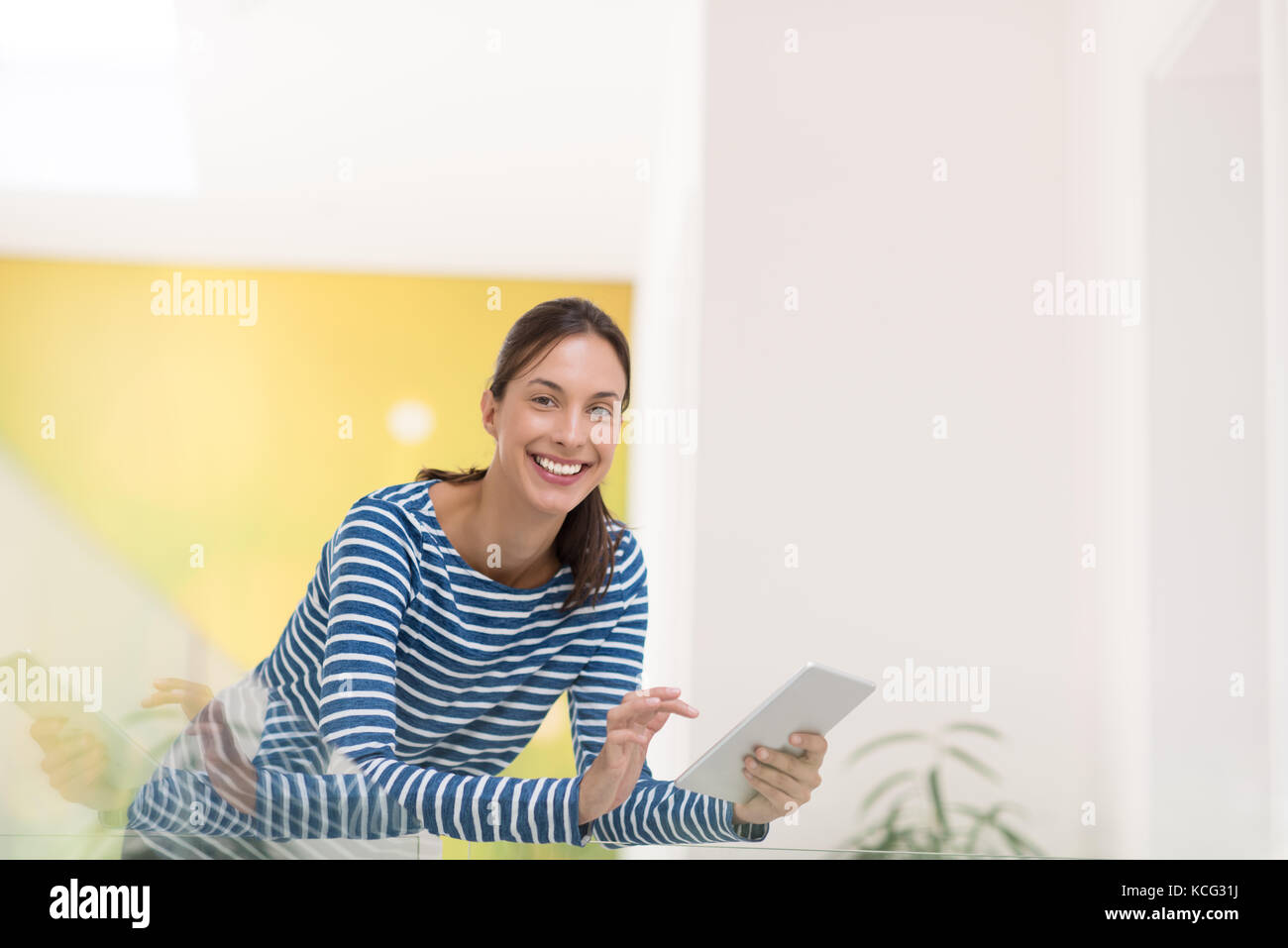 beautiful young woman at home websurfing on internet with tablet Stock ...