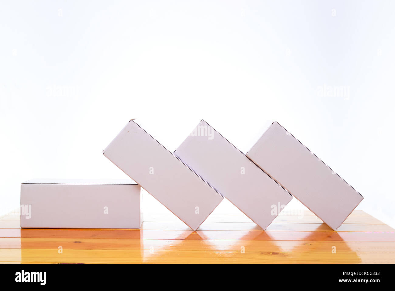 Empty four Package white cardboard box mock up for long items on bright ...