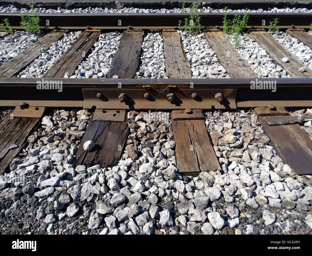 A close up view of a connecting strip joining two railway lines with ...