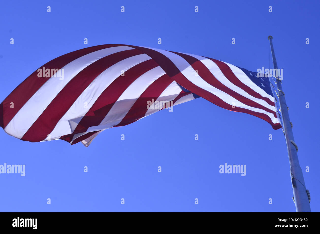 American flag flying at half-staff Stock Photo - Alamy