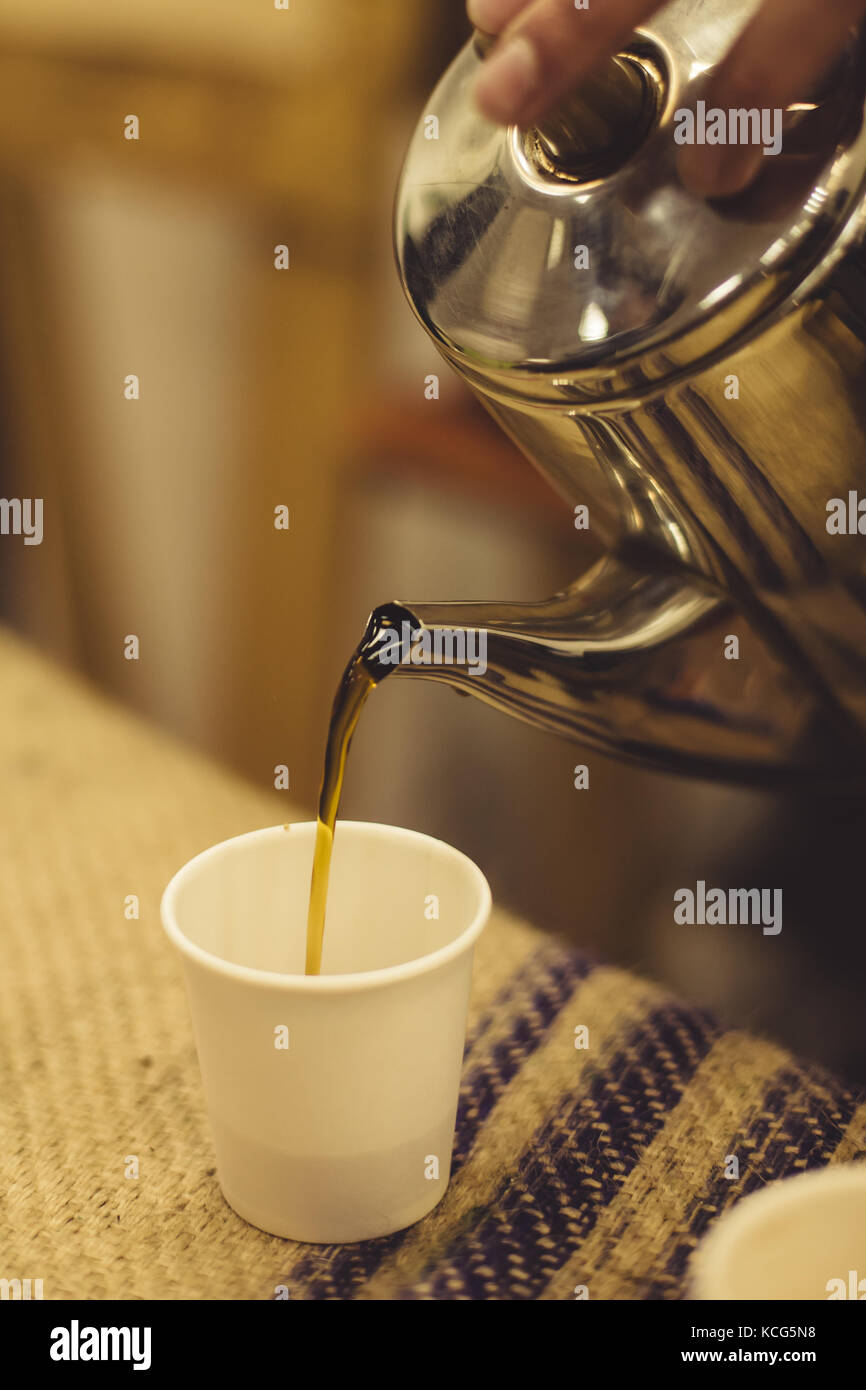 Pouring hot tea in cup hi-res stock photography and images - Alamy