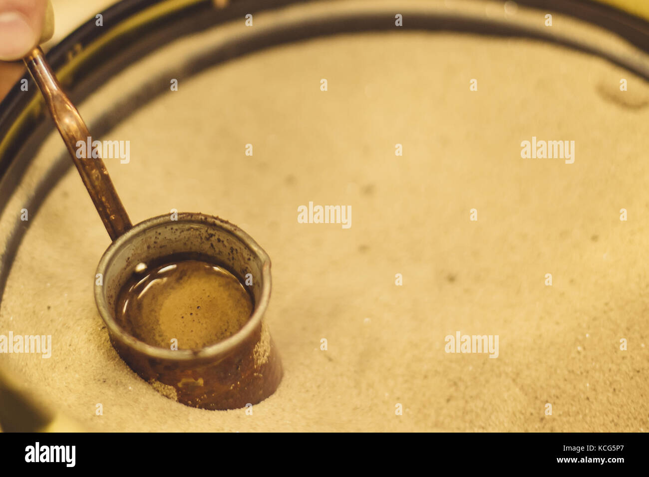 Jezve placed in sand Stock Photo - Alamy