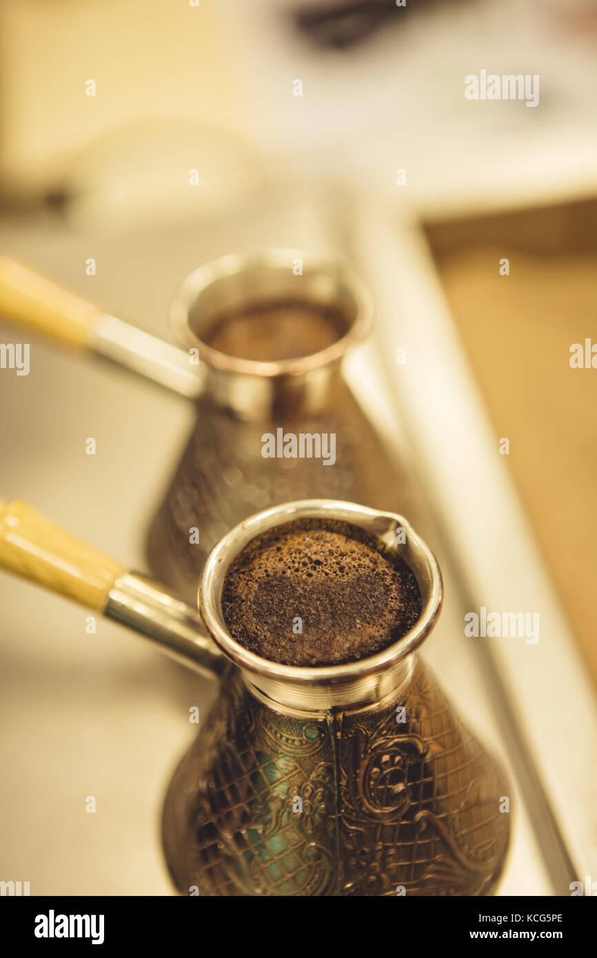 Jezve placed in sand Stock Photo - Alamy