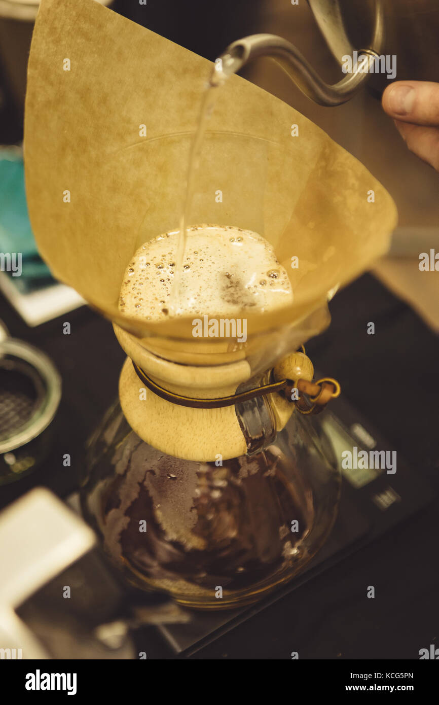 Barista pouring hot water hi-res stock photography and images - Alamy
