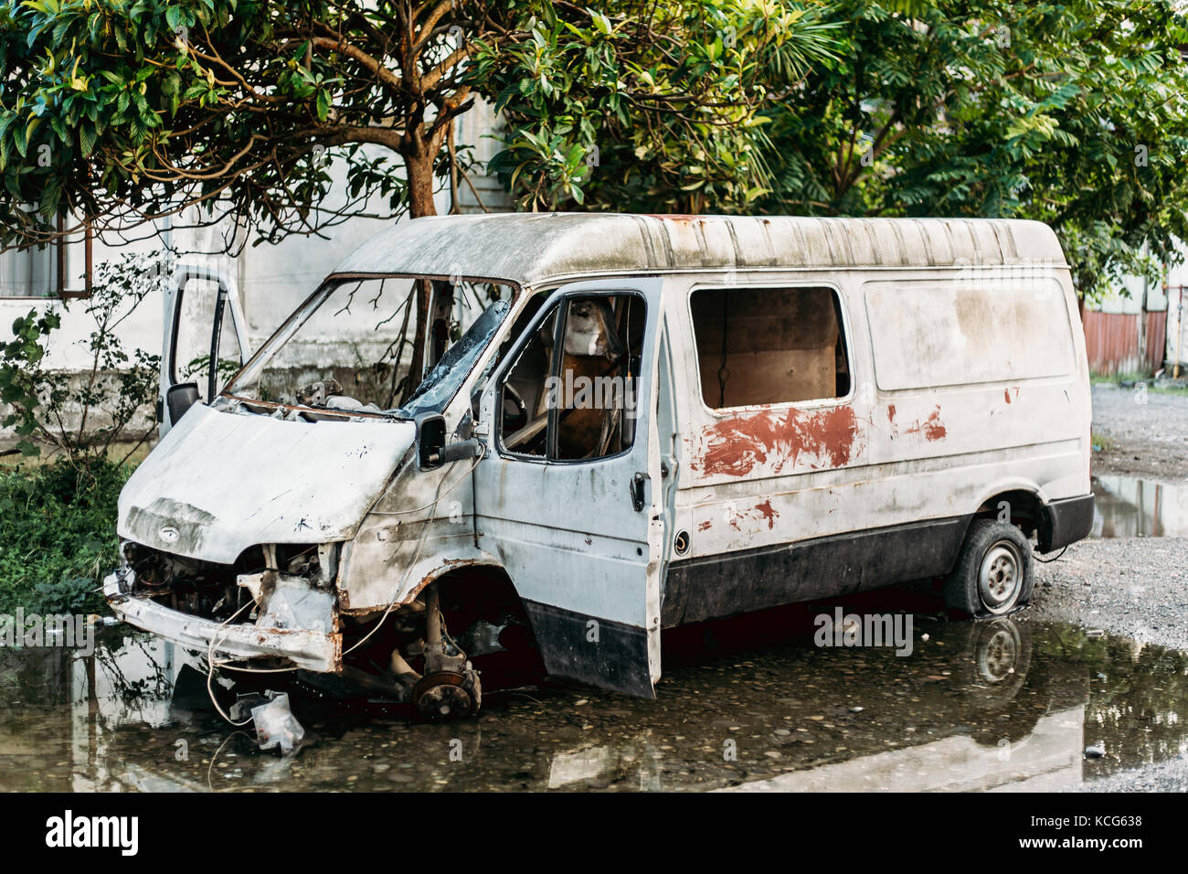 Old Broken Crashed Rusty Minibus Car Abandoned In City. Car Wreck Stock ...