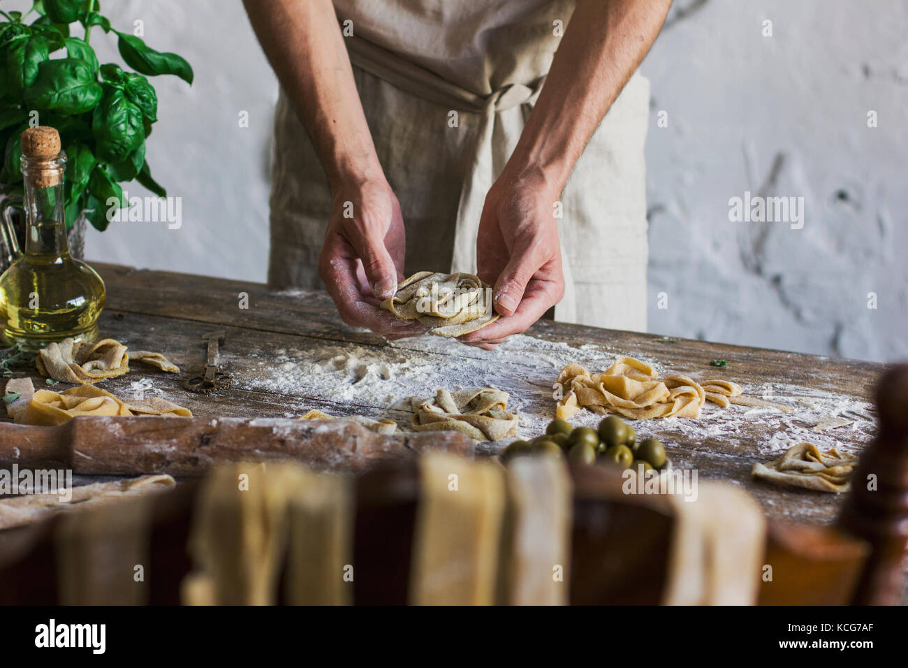 The man making homemade pasta at rustic kitchen Stock Photo - Alamy