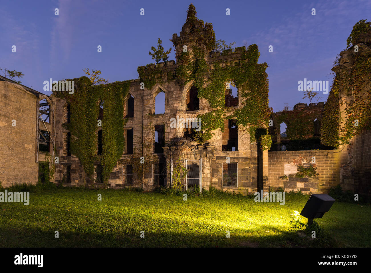 Abandoned Smallpox Hospital ruins on Roosevelt Island illuminated at twilight. New York City ...