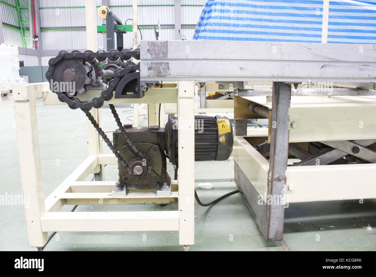 Motor shaft and gear drive chain of Conveyor line Stock Photo - Alamy