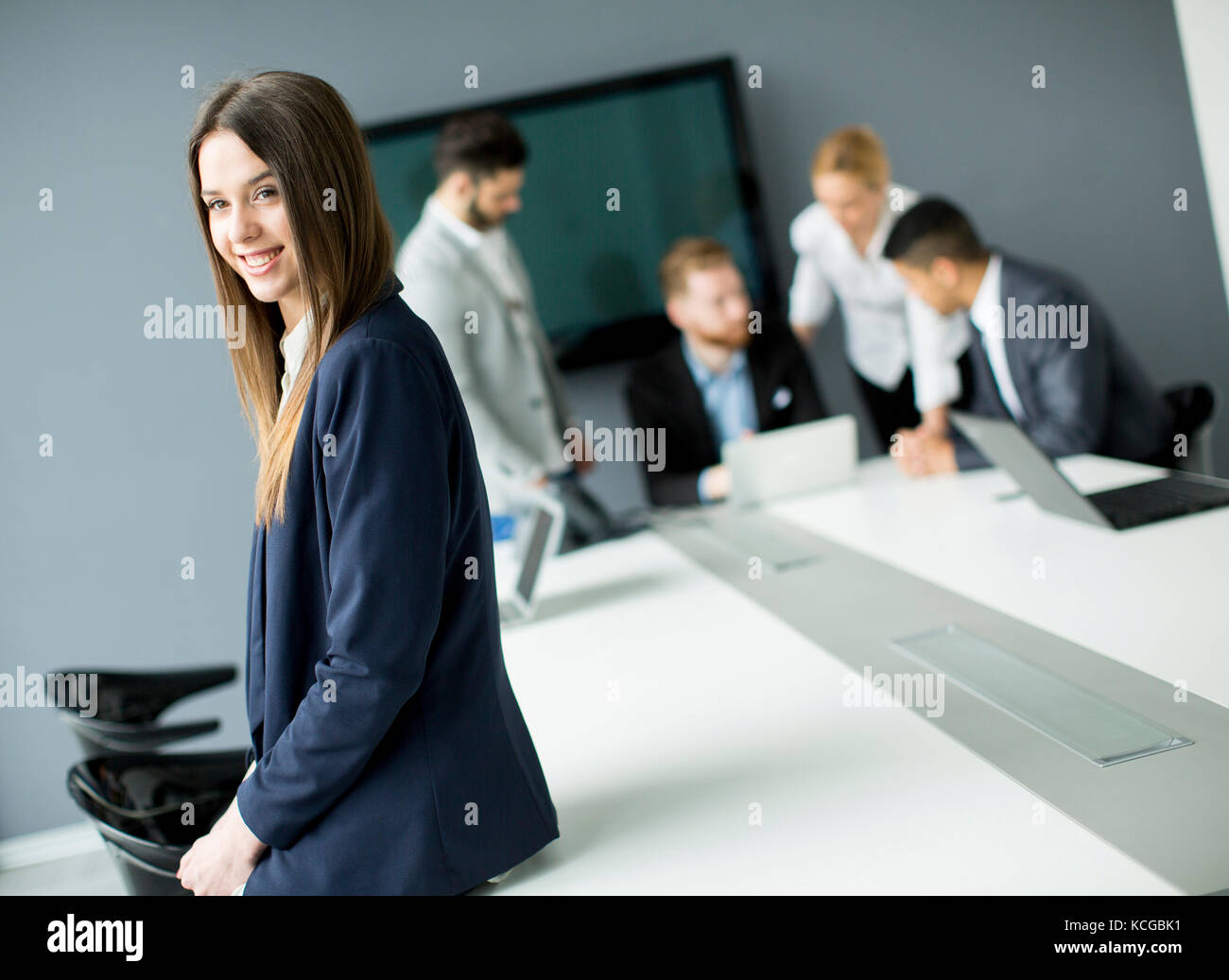 Business team working together in modern office to achieve better ...