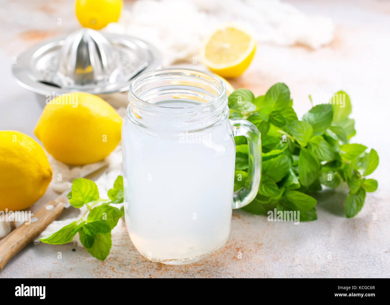 lemon juice in glass and on a table Stock Photo - Alamy