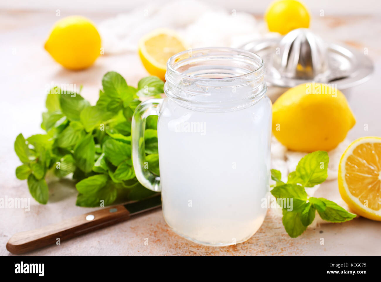 lemon juice in glass and on a table Stock Photo - Alamy