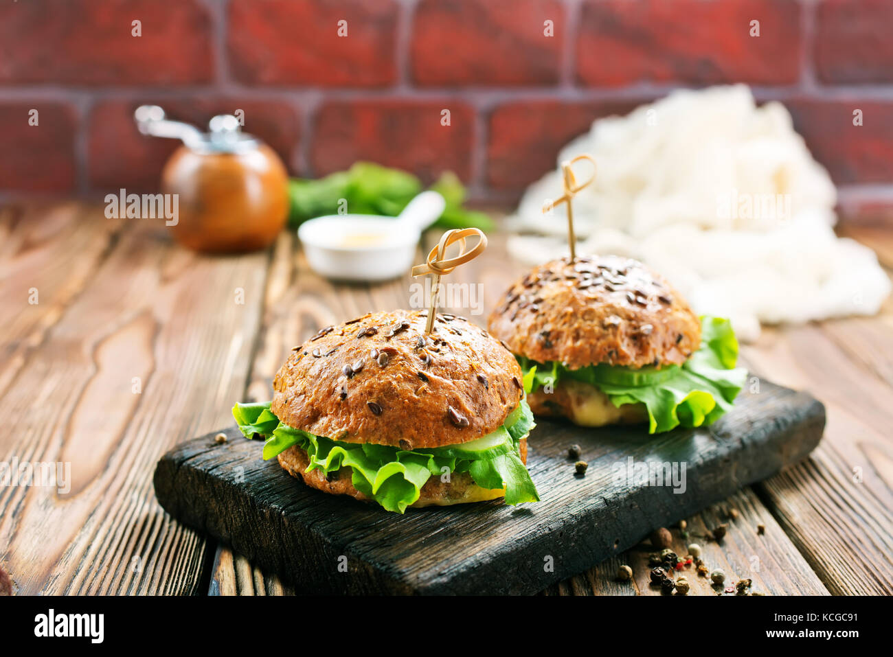 fresh burgers on a table, stock photo Stock Photo - Alamy