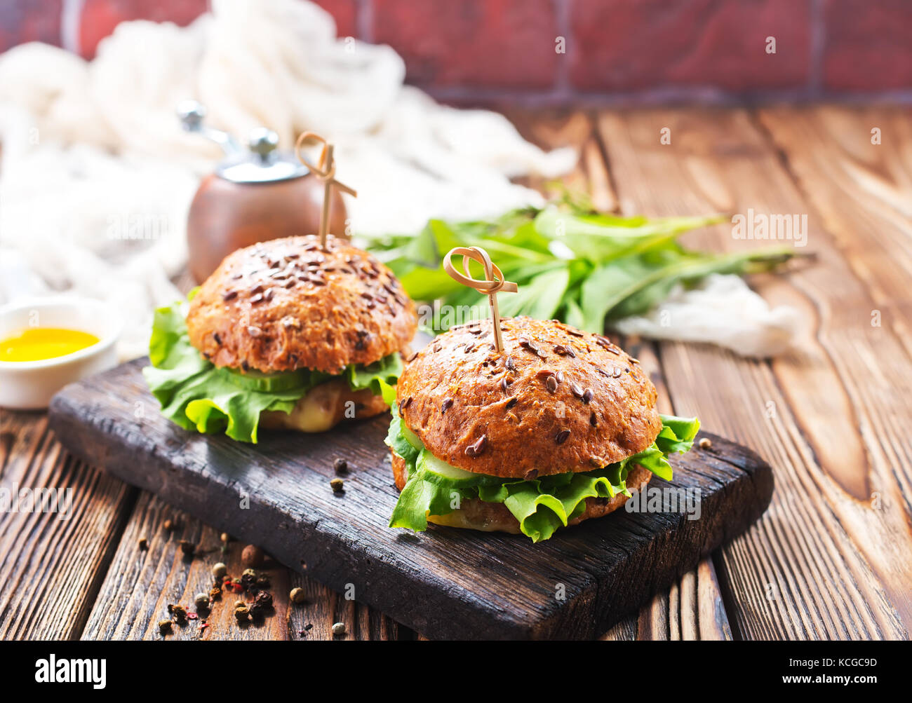 fresh burgers on a table, stock photo Stock Photo - Alamy