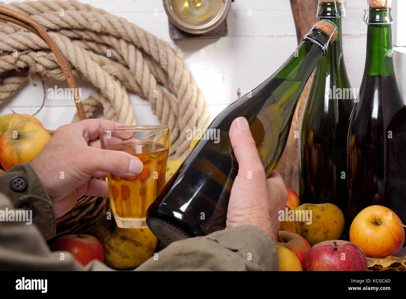 a man with a bottle of cider, close-up Stock Photo - Alamy