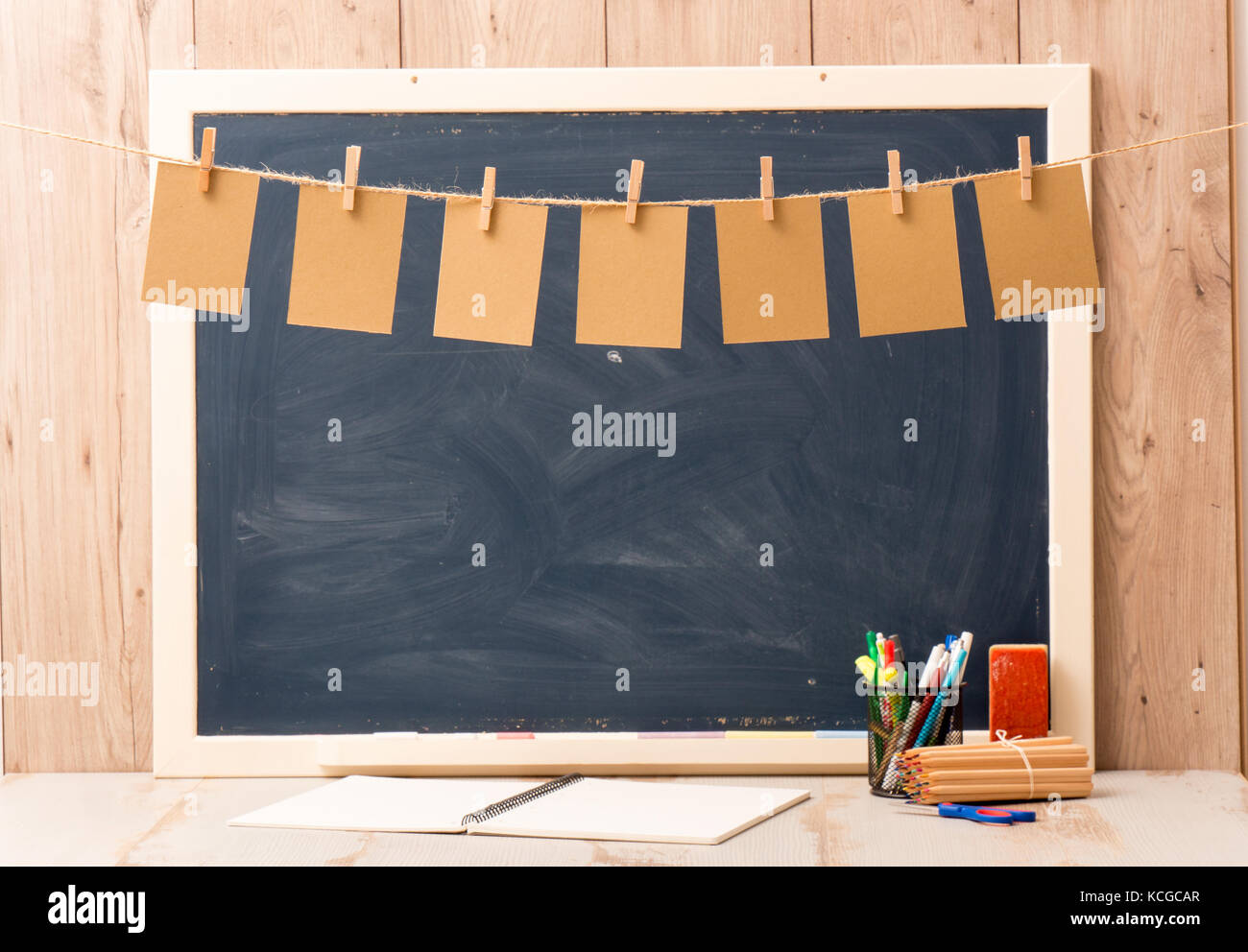 a blackboard with seven small sheets of paper Stock Photo - Alamy