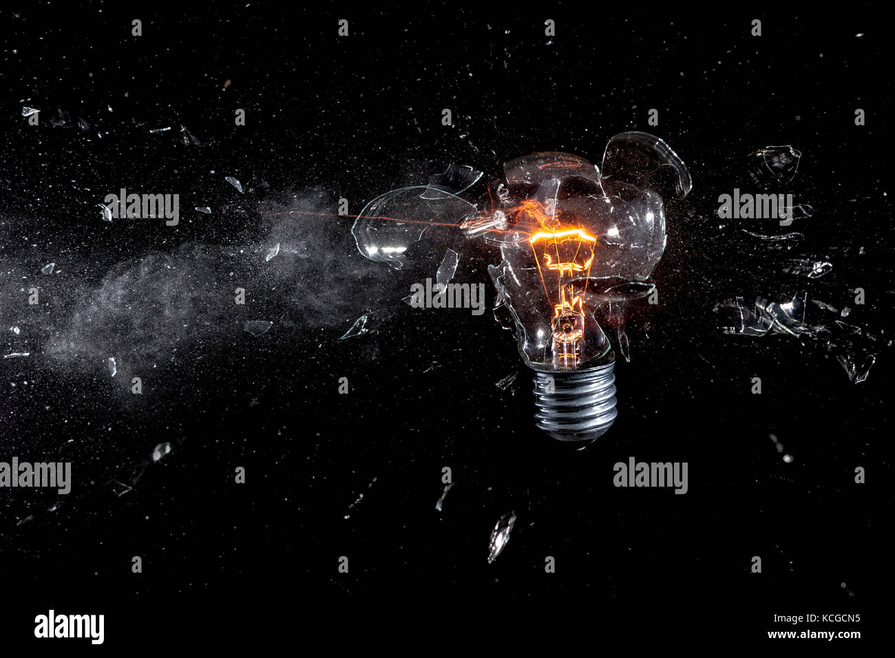 glass bulb explosion on black background Stock Photo - Alamy