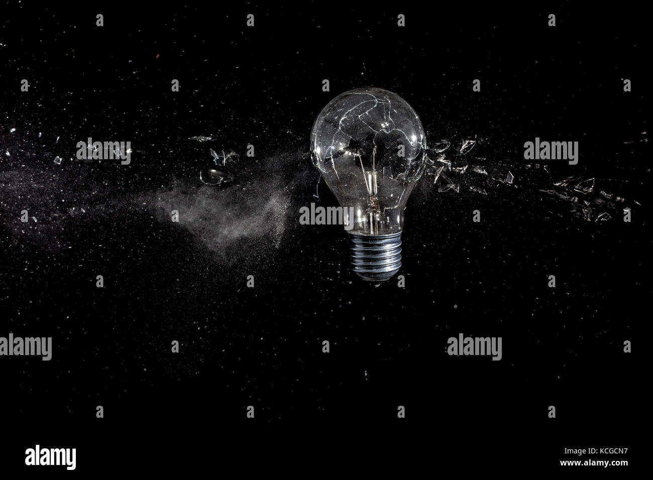 glass bulb explosion on black background Stock Photo - Alamy