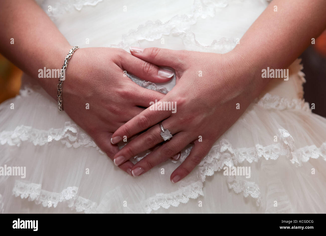 Hands of a Bride in Wedding Dress Stock Photo - Alamy