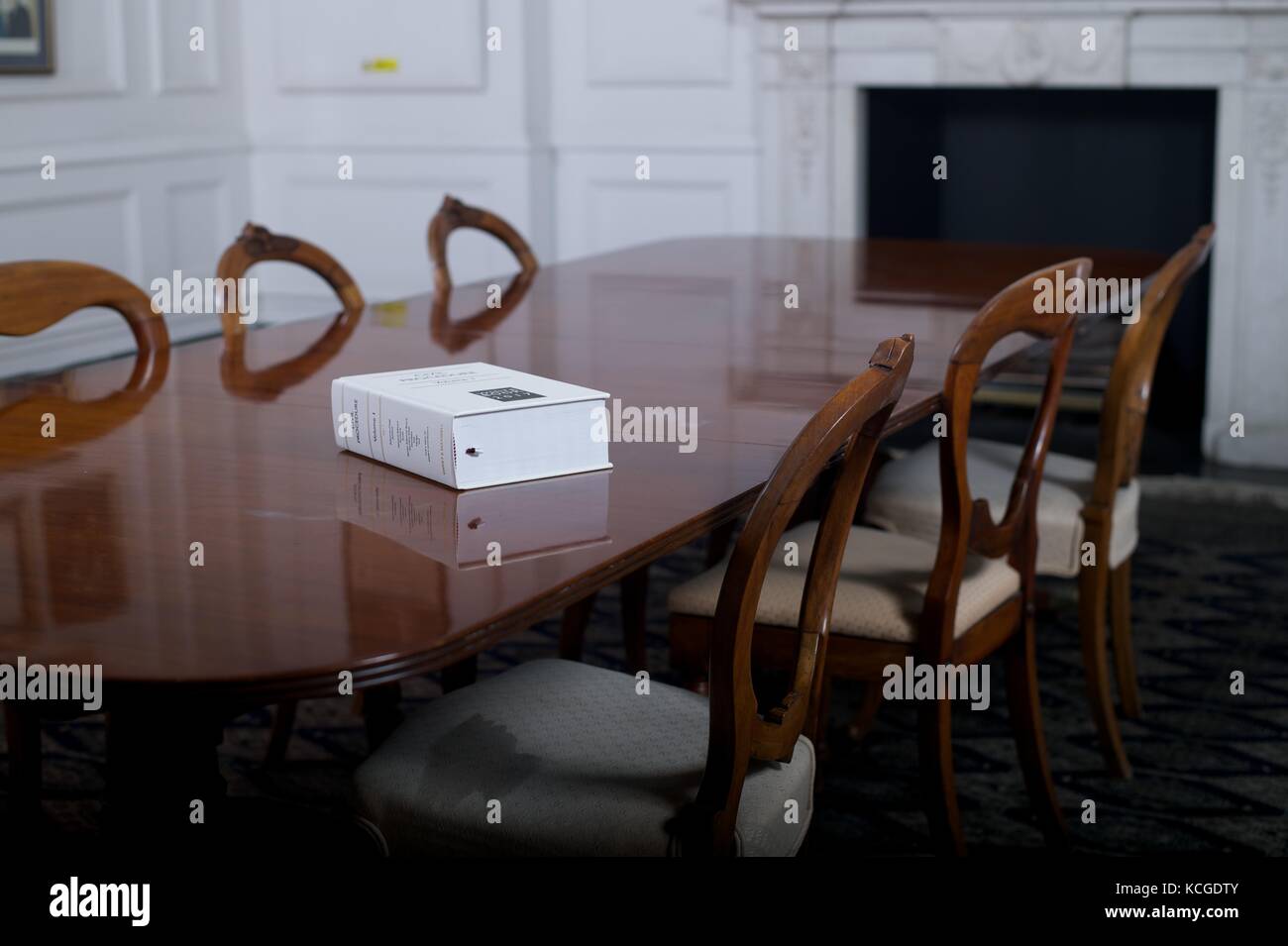 Boardroom Table with Legal encyclopaedia Stock Photo - Alamy