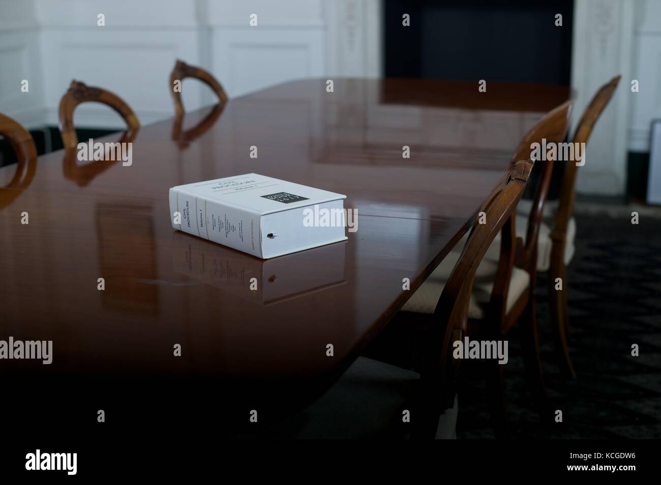 Boardroom Table with Legal encyclopaedia Stock Photo - Alamy