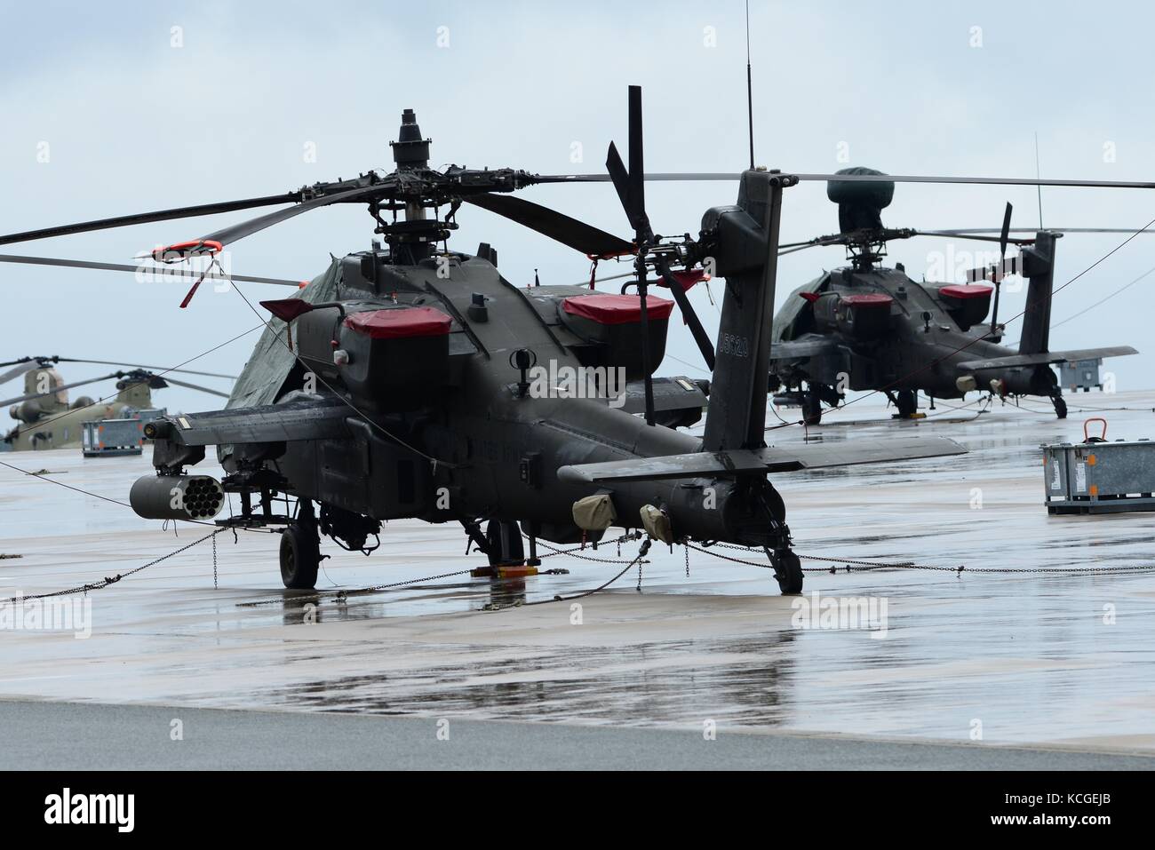 On a cold, windy, rainy afternoon, Apache and Chinook helicopters from ...