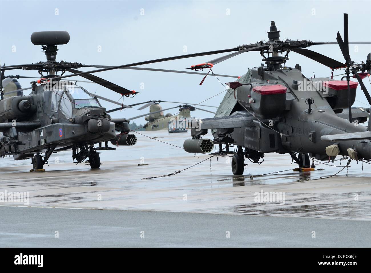 On a cold, windy, rainy afternoon, Apache and Chinook helicopters from ...