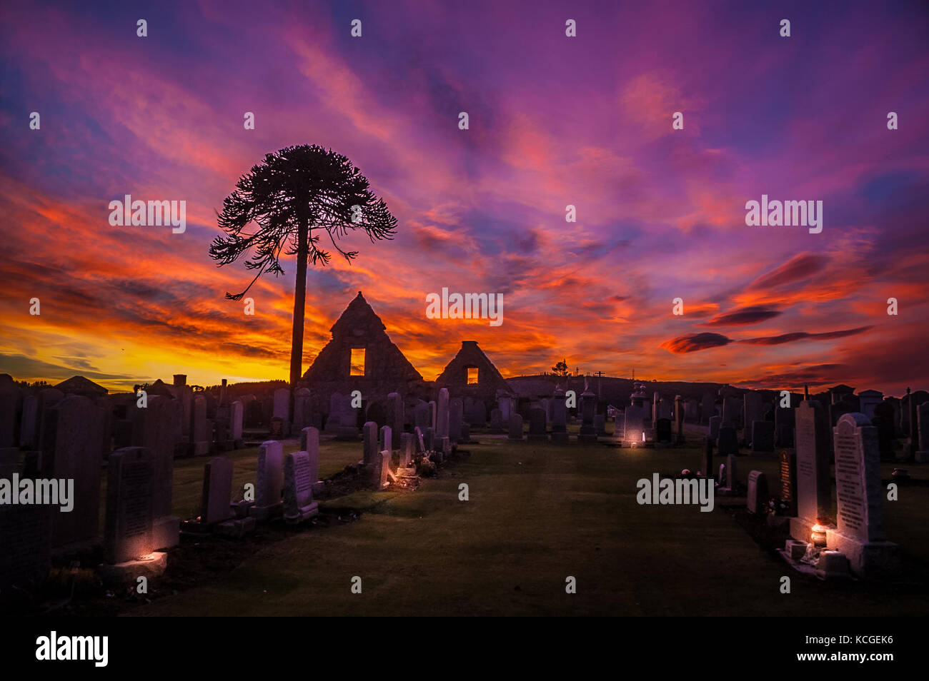 Sunset over graveyard Stock Photo - Alamy