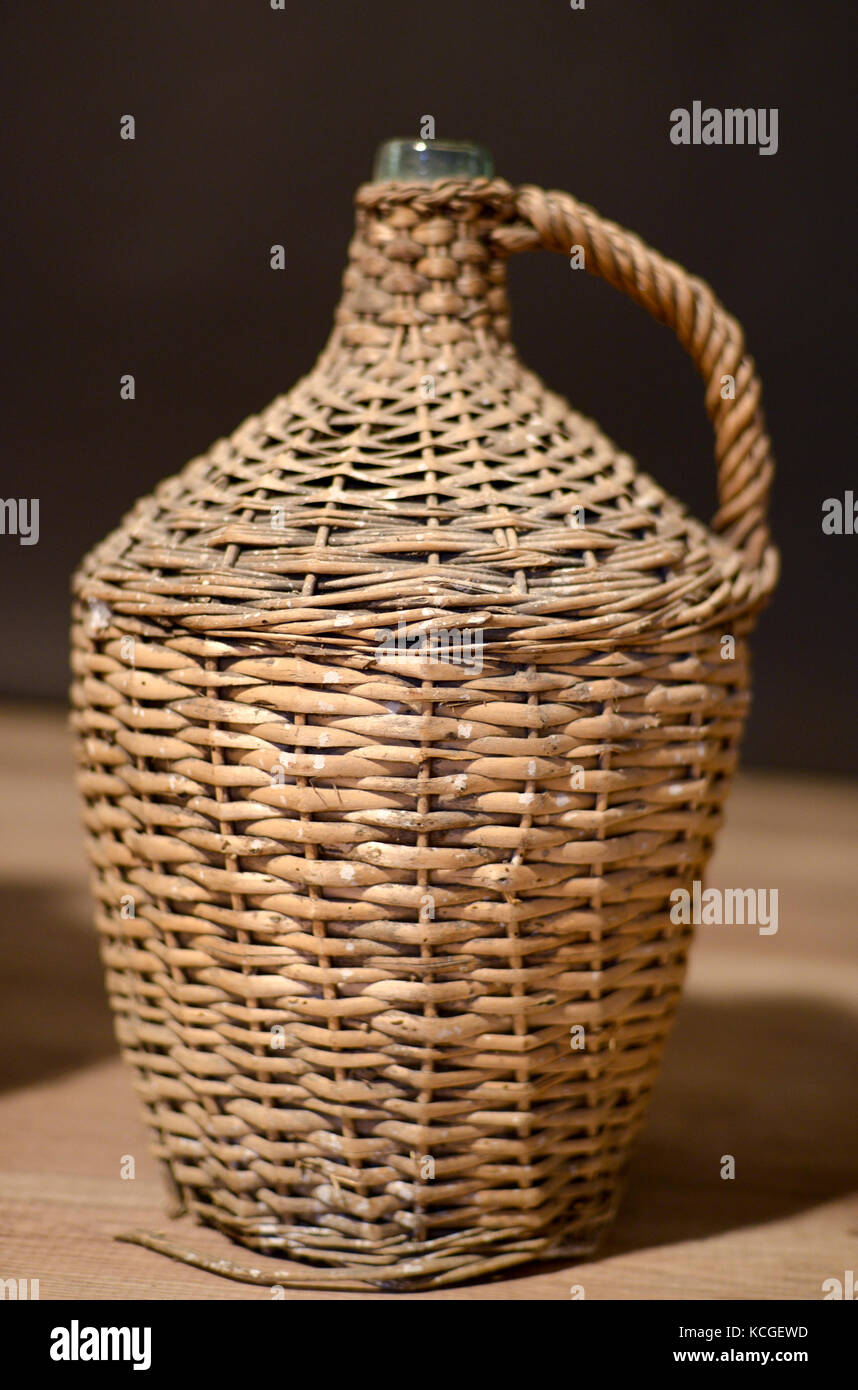 image of a glass bottle for rakia protected by wood mesh Stock Photo ...