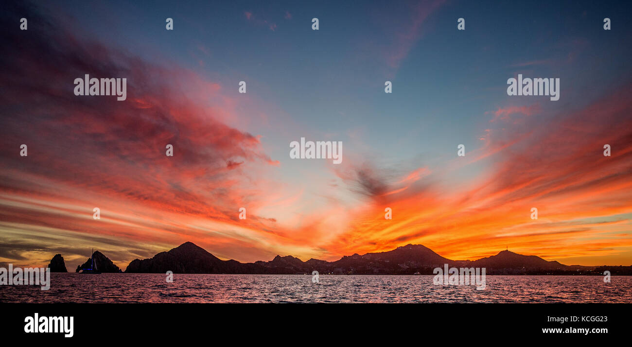 Sunset with a stunning beautiful sky above the city of Cabo San Lucas ...