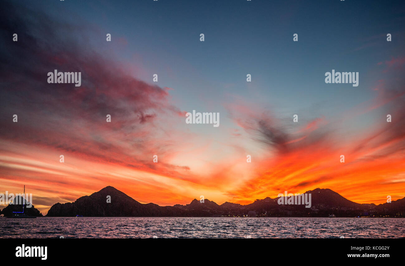 Sunset with a stunning beautiful sky above the city of Cabo San Lucas ...