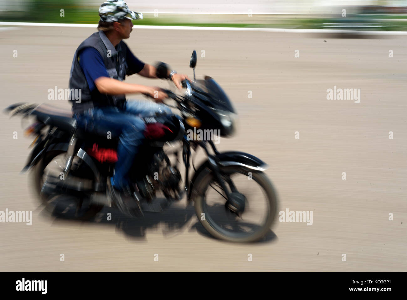 Biker with no helmet hi-res stock photography and images - Alamy