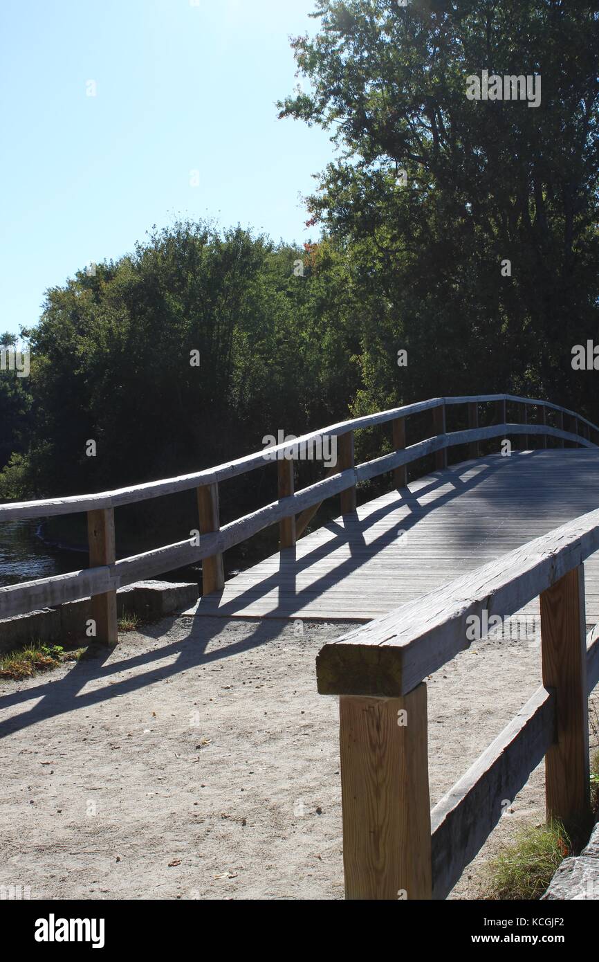 A beautiful pathway with a bridge going over water in a national ...