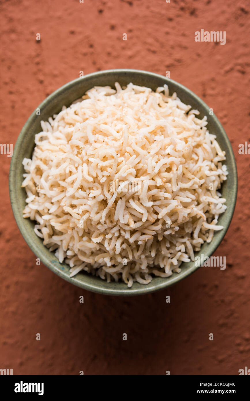 Stock photo of Indian brown wholegrain basmati cooked rice and raw rice ...