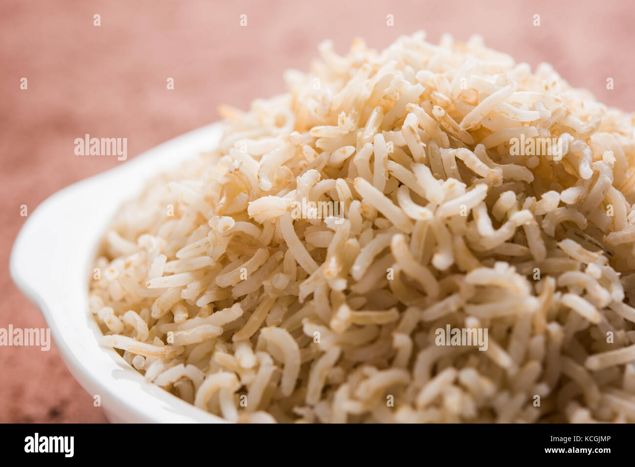 Stock photo of Indian brown wholegrain basmati cooked rice and raw rice ...