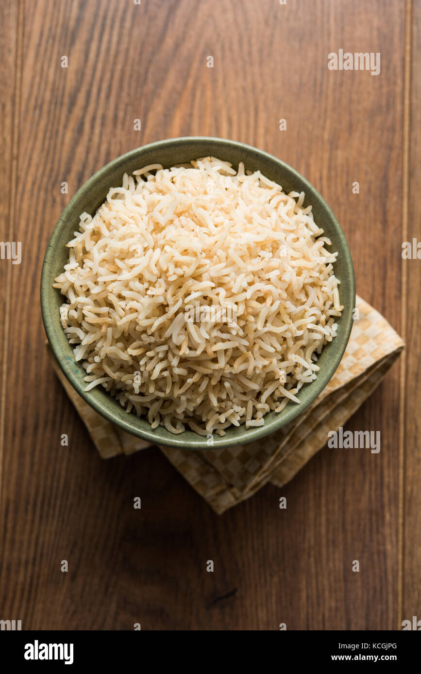 Stock photo of Indian brown wholegrain basmati cooked rice and raw rice ...