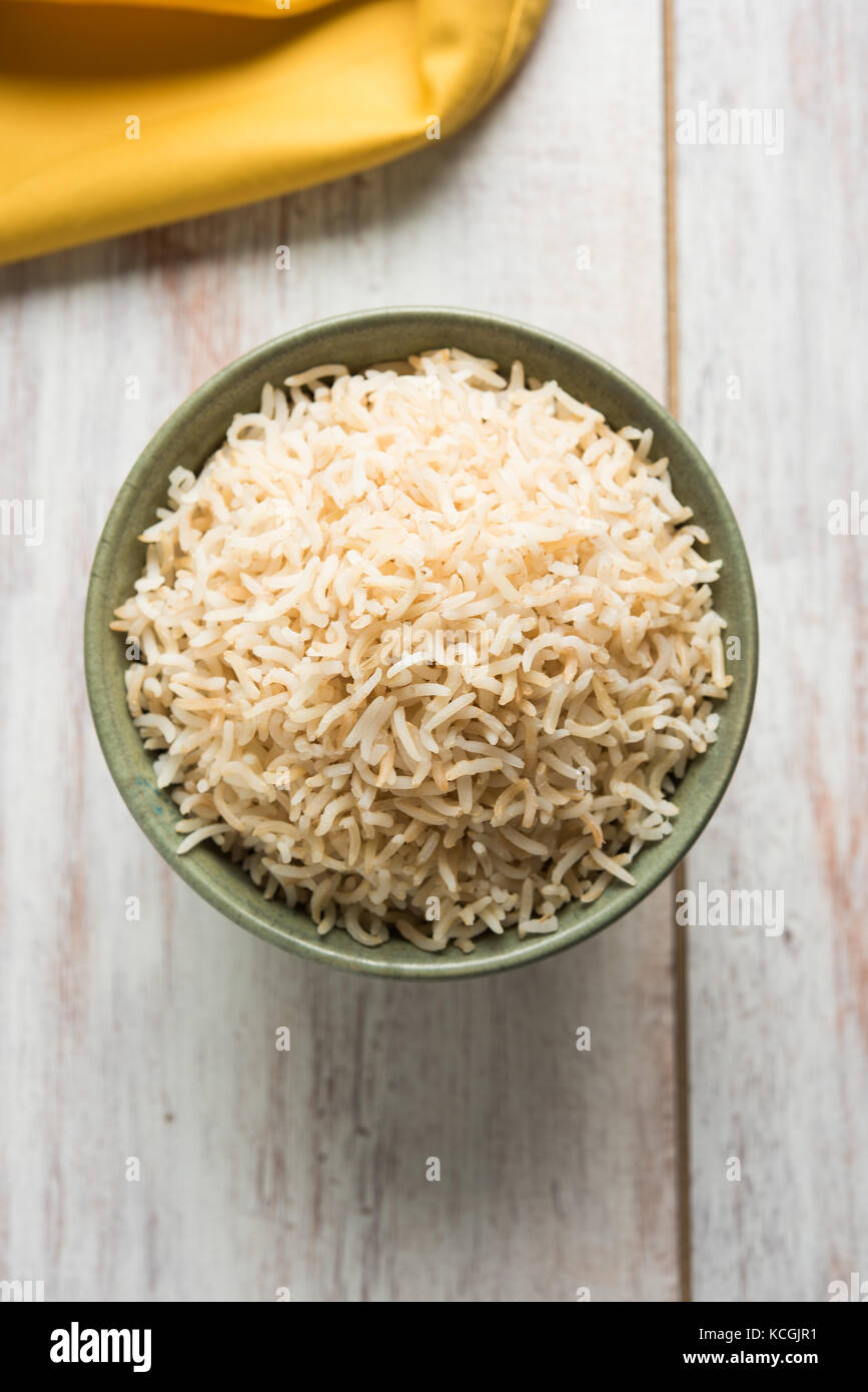 Stock photo of Indian brown wholegrain basmati cooked rice and raw rice ...