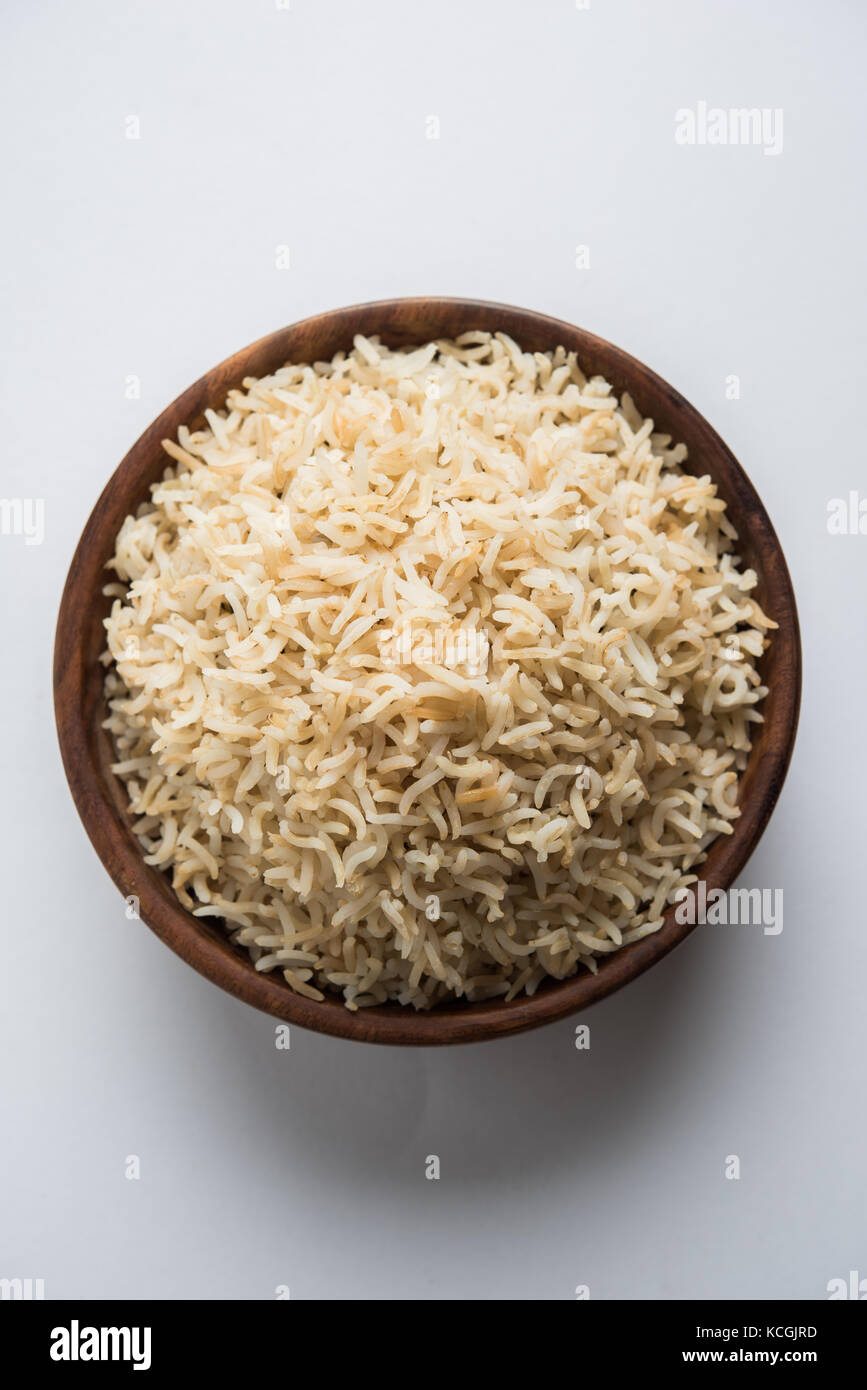 Stock photo of Indian brown wholegrain basmati cooked rice and raw rice ...