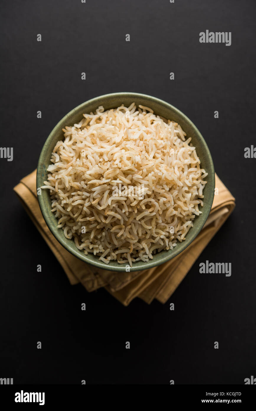 Stock photo of Indian brown wholegrain basmati cooked rice and raw rice ...
