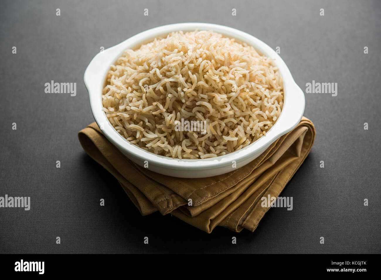 Stock photo of Indian brown wholegrain basmati cooked rice and raw rice ...