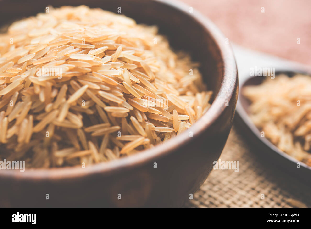 Stock photo of Indian brown wholegrain basmati cooked rice and raw rice ...