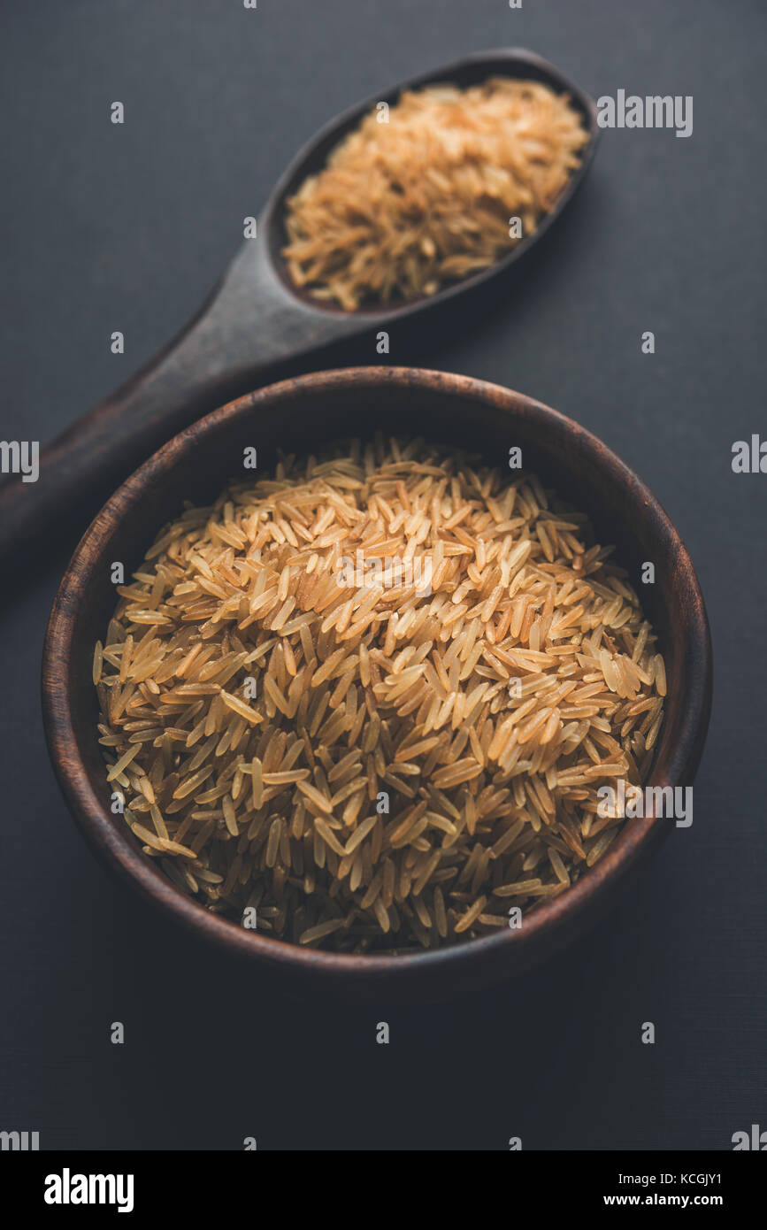 Stock photo of Indian brown wholegrain basmati cooked rice and raw rice ...