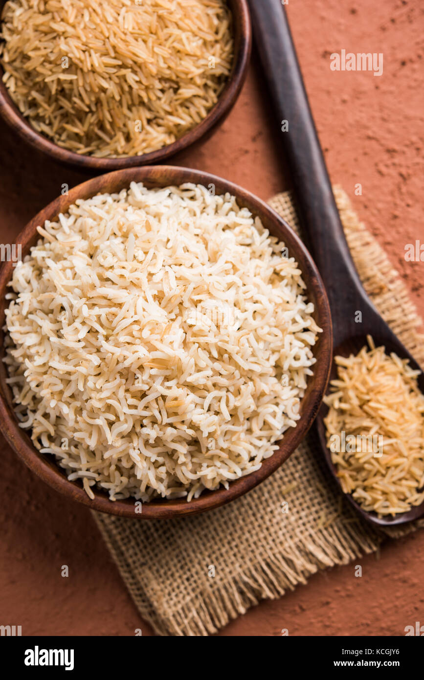 Stock photo of Indian brown wholegrain basmati cooked rice and raw rice ...