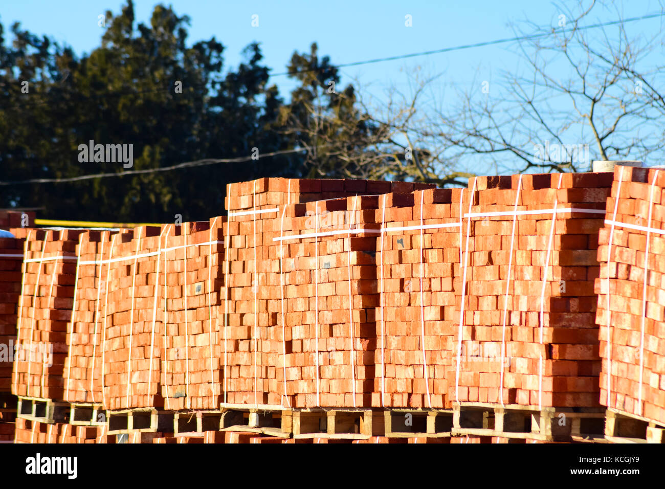 Red bricks stacked into cubes. Warehouse bricks. Storage brickworks ...